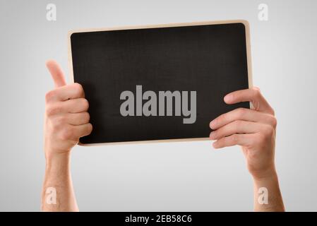 Male hands hold blackboard with sign pointing healthy lifestyle ...