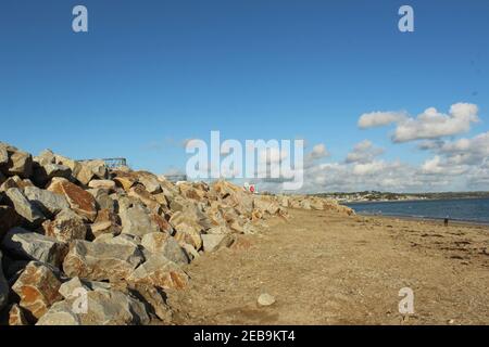Rip rap aka rock armour aka shot rock on Marazion beach. The sea ...