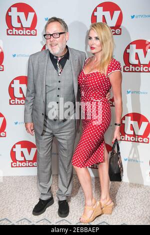 Vic Reeves and Nancy Sorrell arrive with their twin daughters Elizabeth ...