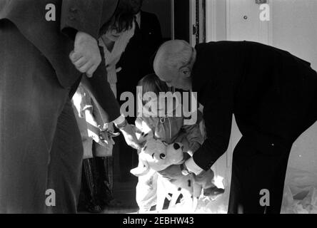 John F. Kennedy, Jr., plays with his dog, Shannon, at Brambletyde house ...