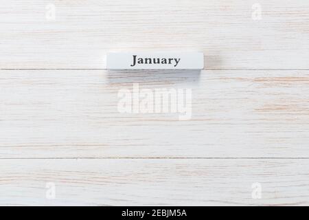 Whine wooden block of calendar with month July on vintage background ...