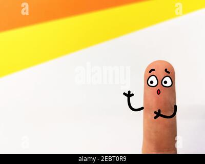 One finger is decorated as one person. He is confused and sad Stock ...