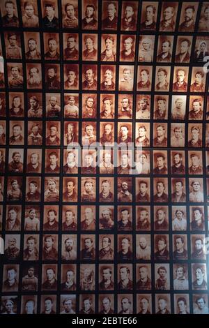 Wall of prisoner portraits with their crime noted on their photo at ...