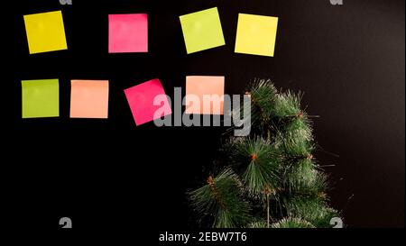lots of colored stickers on a black background. stickers on the wall ...