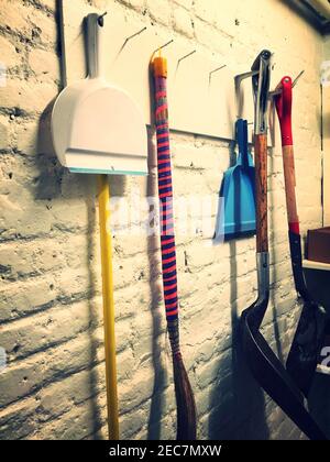 Organized hand tools hanging on workshop wall, ready for carpentry and ...