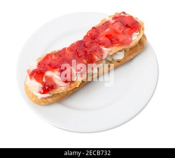 Delicious eclair with strawberry jam. Isolated on a white background ...
