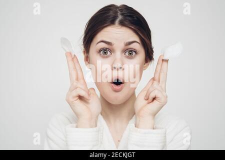 emotional woman with sponges in hands clean skin cosmetology ...