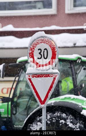Give way sign with fresh snow obscuring the sign. Kent, England, UK ...
