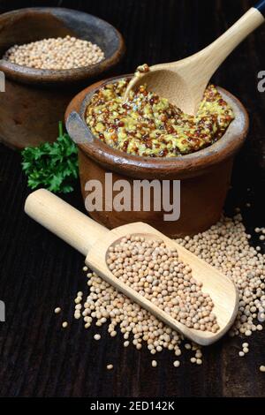 Coarse-grained Dijon mustard in pots, mustard seeds, France Stock Photo ...