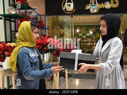 Mazar I Sharif. 14th Feb, 2021. Nahid Padram arranges the flowers at ...