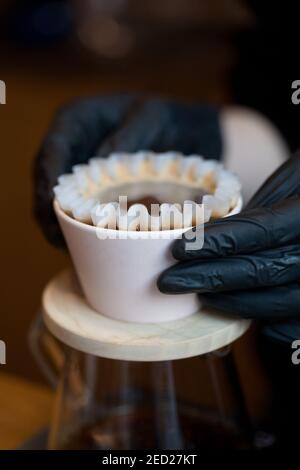 hand holding a paper glass to pour the lemonade soda soft drink machine ...