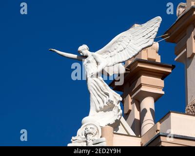 victory fascism angel statue on top of old building Stock Photo - Alamy