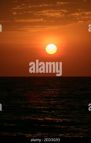 The breathtaking scenery of round red sunset over Lake Victoria ...