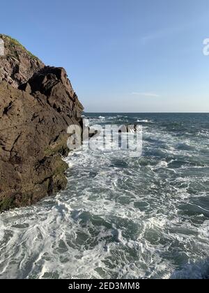 Waves splashing against a rocky cliff at Salt Point State Park in ...