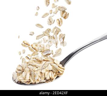 Dry oat flakes falling on white background Stock Photo - Alamy