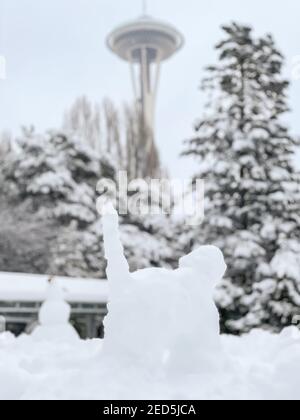 Seattle, USA. 13th Feb, 2021. Mid-day a Snowman at the Seattle Center ...