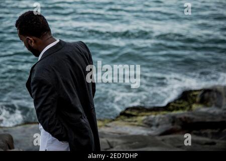 A man enjoying the mesmerizing view of the sea Stock Photo - Alamy