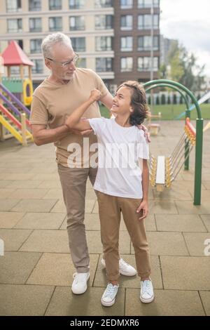 Father and son feeling happy and strong Stock Photo - Alamy