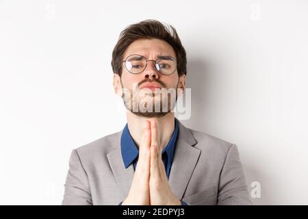 Clingy guy in glasses asking for last favour, begging for help and ...