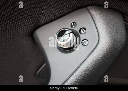 Side mirrors control panel on side door. Car driver adjust side mirror ...