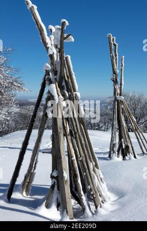 Wooden sticks covered with snow Stock Photo - Alamy