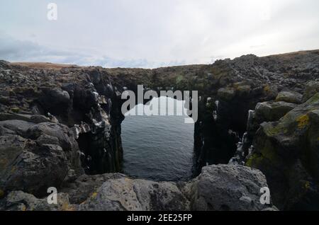 The stone bridge. Arnarstapi. Snaefellsnes peninsula. Iceland Stock ...