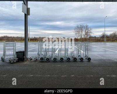 empty luggage trolleys standing on the bus station Stock Photo - Alamy