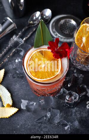 Cocktail shaker and negroni cocktail on dark background with copy space ...