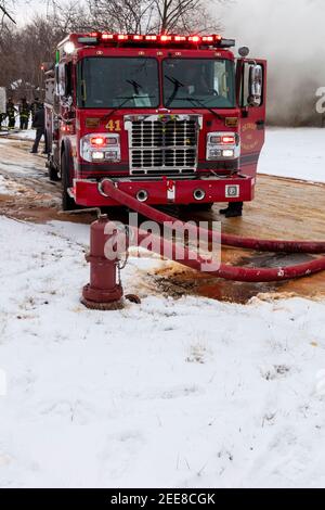 Fire engine pumper hooked to fire hydrant at house fire, Detroit ...