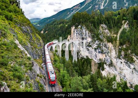The famous Swiss mountain train of Bernina Express crossed italian and ...
