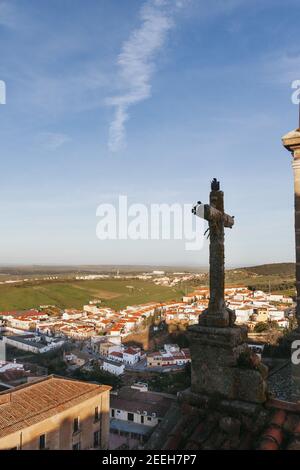 Mesmerizing view of a detail of an old and damaged cross in Caceres ...