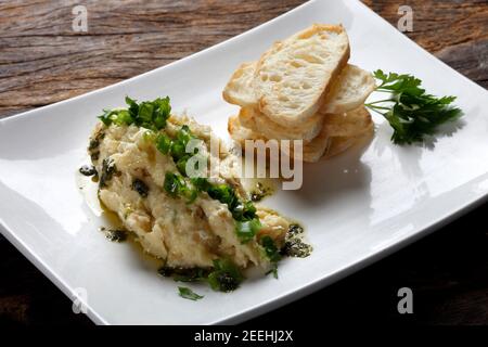 Cod shredded with ciabatta Stock Photo - Alamy