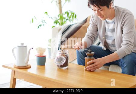 Japanese man making coffee at home Stock Photo - Alamy