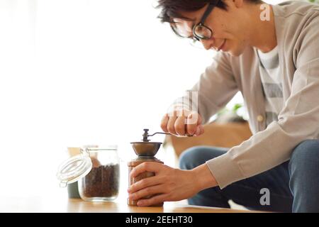 Japanese man making coffee at home Stock Photo - Alamy