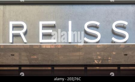 Reiss clothing store shop sign logo Stock Photo - Alamy