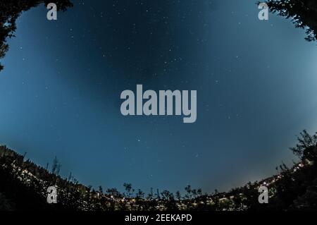 A low angle shot of a starry sky with long exposure at night in ...