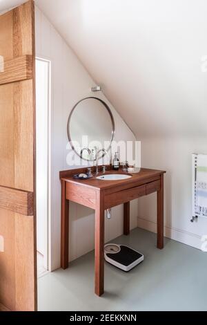 Modern loft bathroom interior with vanity, white bathtub, interior ...