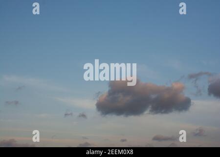 Grey color clouds partly cover the sky in the daytime Stock Photo - Alamy