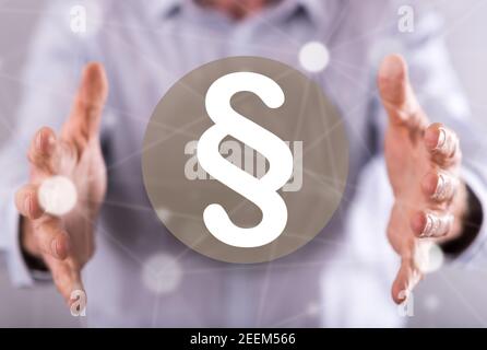 Law concept between hands of a man in background Stock Photo - Alamy