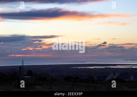 Pink evening sky, sunset, Caernarfon, Gwynedd, north west wales uk ...