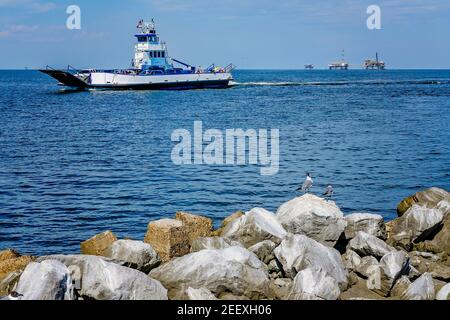 The Mobile Bay Ferry passes a rock jetty, April 28, 2022, in Dauphin ...