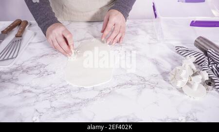 Step by step. Cutting out snowflakes with cookie cutters out of white ...