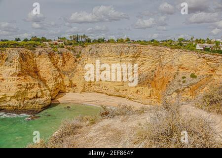 View on typical cliffy beach at Algarve coastline in Portugal Stock ...