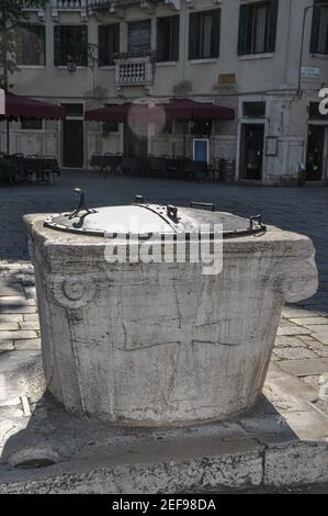 Typical venetian cisternae near calle del tentor, Venice Italy. Stone ...