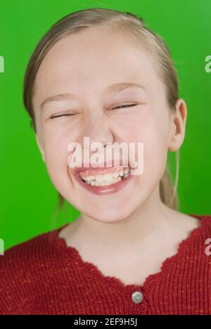 blond tween girl making a face expression of surprise Stock Photo - Alamy