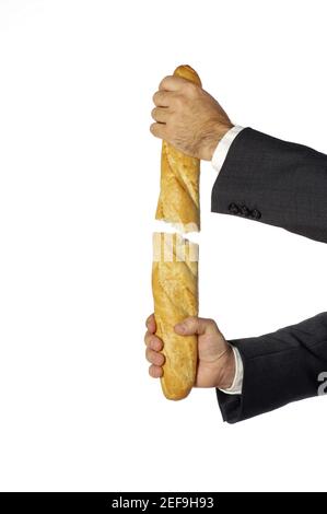 Breaking bread close up Stock Photo - Alamy