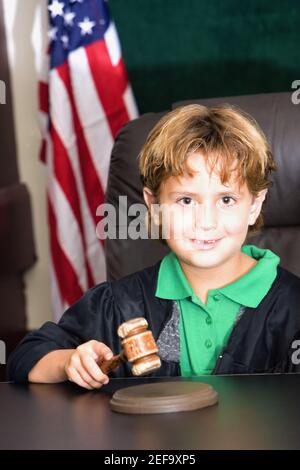 Boy imitating a judge in a courthouse Stock Photo - Alamy