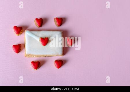 Envelope and many small hearts on red background with space for text ...