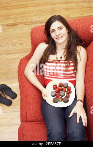 The high-angle view of strawberries on the white surface Stock Photo ...
