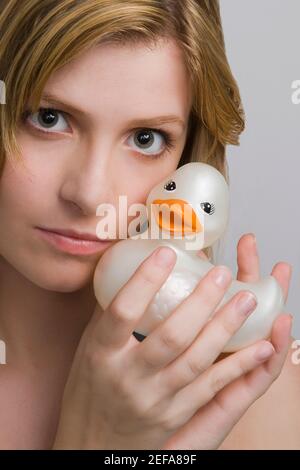 Schoolchild, teenage student girl with toy on isolated studio ...